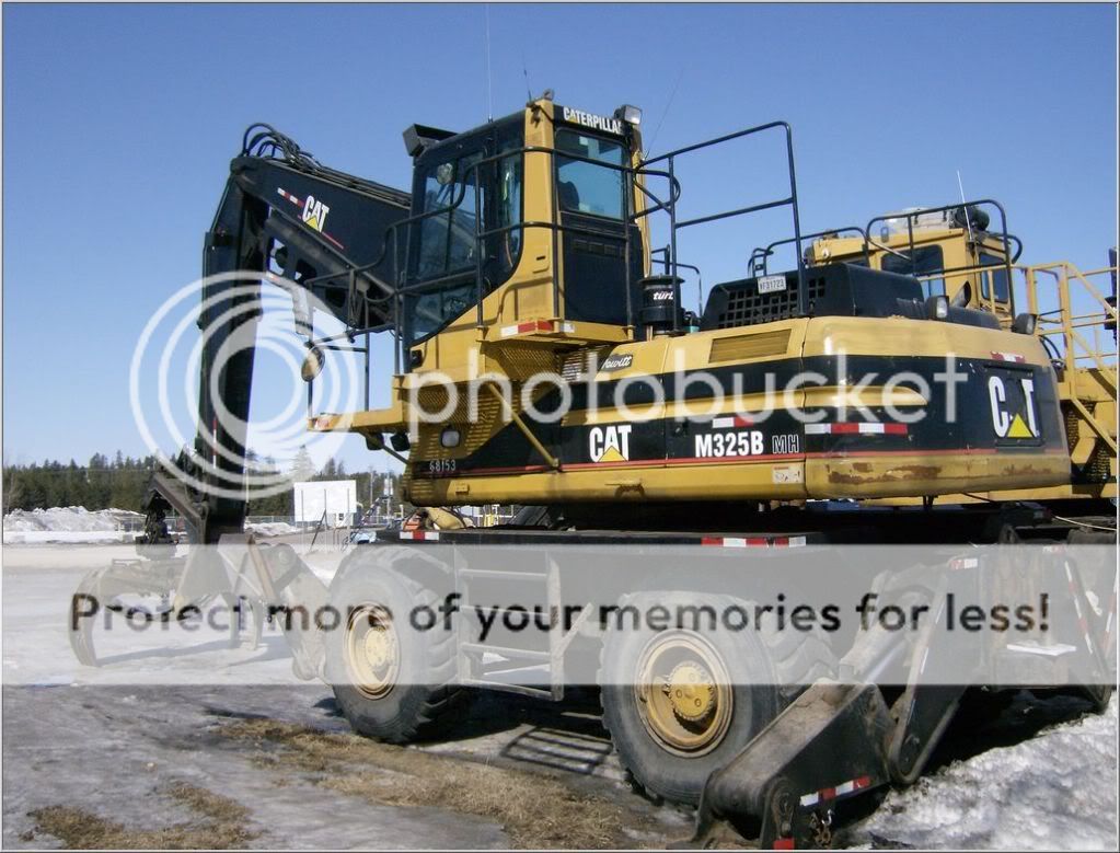 Hydraulic Excavators turned into Log Loader, then put on Rubber Tire SP ...